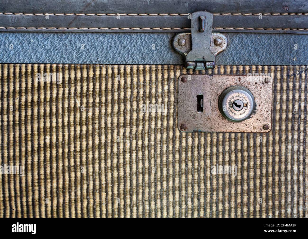 A close-up of a vintage Dresner suitcase from the 1950s reveals a lock ...