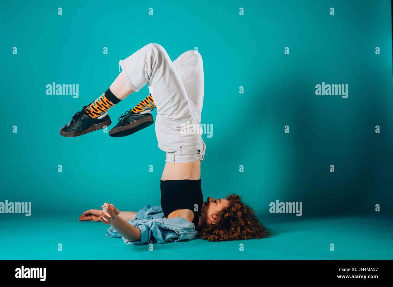 Dance moves performed by an acrobatic flexible female dancer dancing in ...