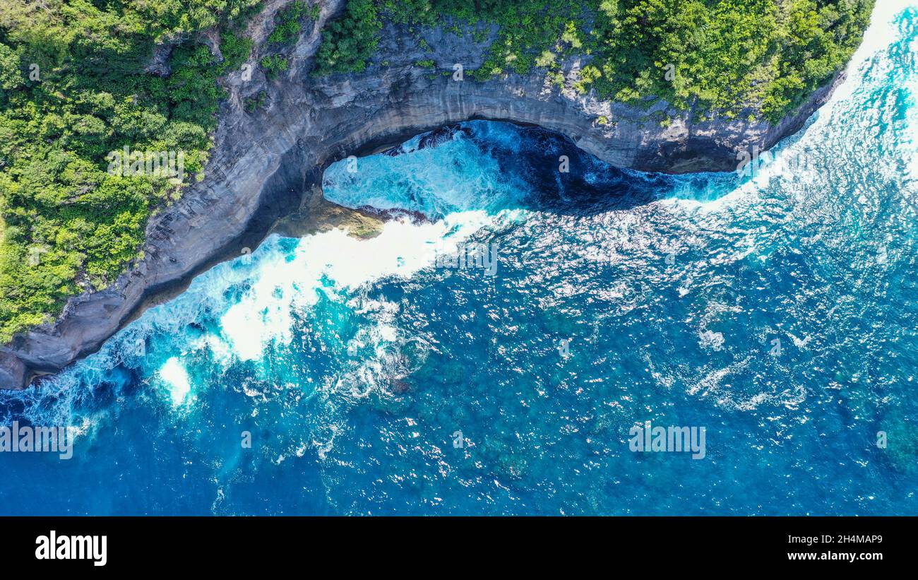Aerial view of cliffs and the blue sea in Nusa Penida Island Stock ...