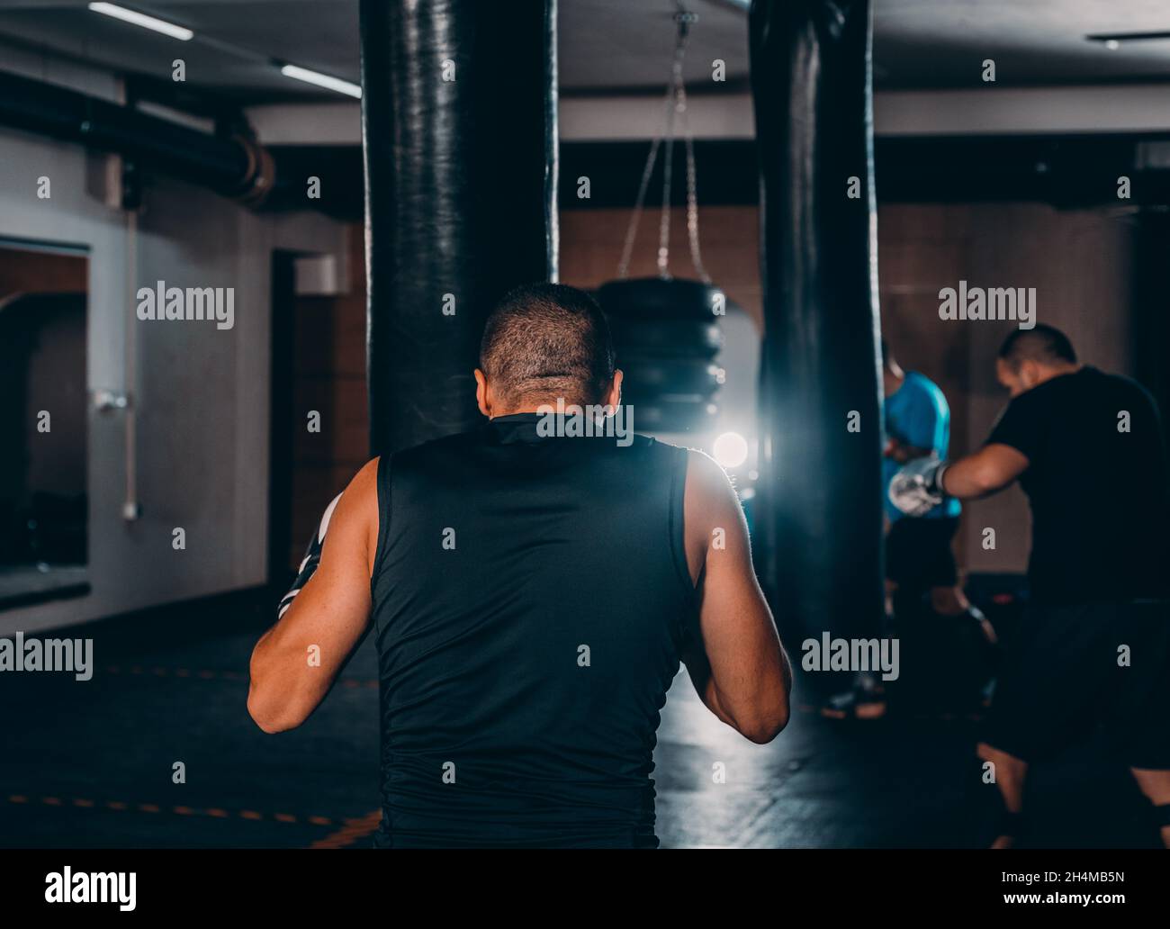 Concept of a healthy lifestyle.Young athlete fighter practicing kicks ...