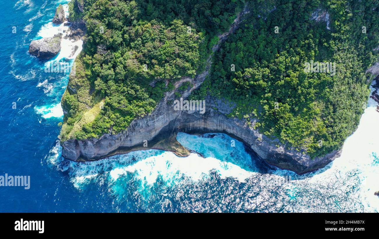 Taken by drone the view of the green cliffs with the beauty blue ocean ...