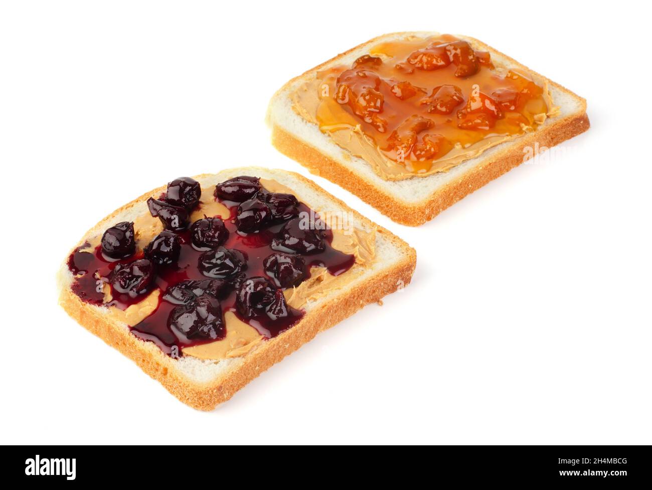Sandwiches or bread toast with peanut butter and fruit jelly isolated on a white background ...