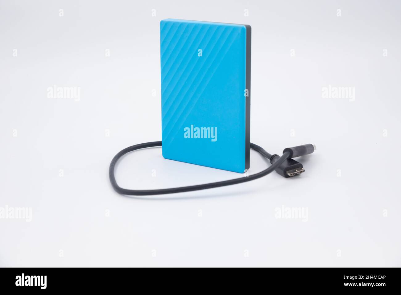 Blue external hard drive for data storage and security - isolated on ...