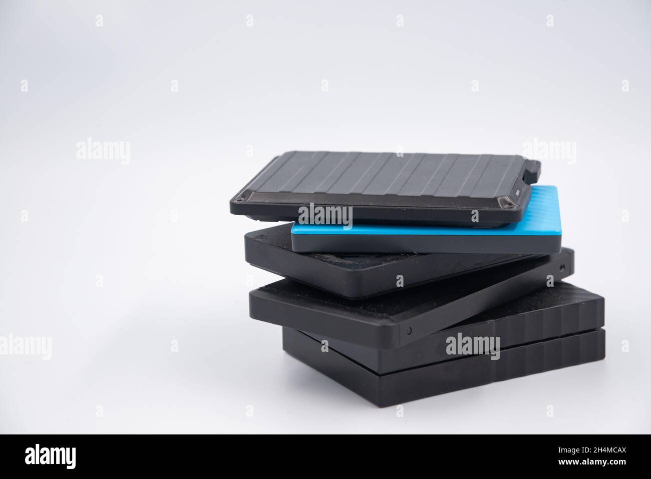 Small portable hard drives in stack Stock Photo - Alamy