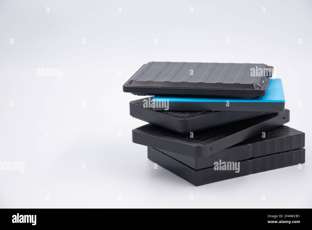 Small portable hard drives in stack Stock Photo - Alamy