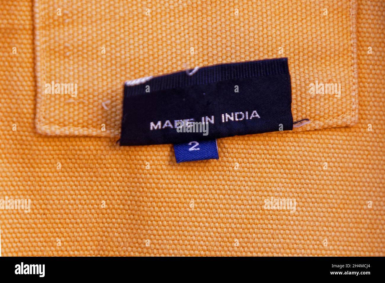 Label of clothing manufacturer place of production on shirt Stock Photo ...
