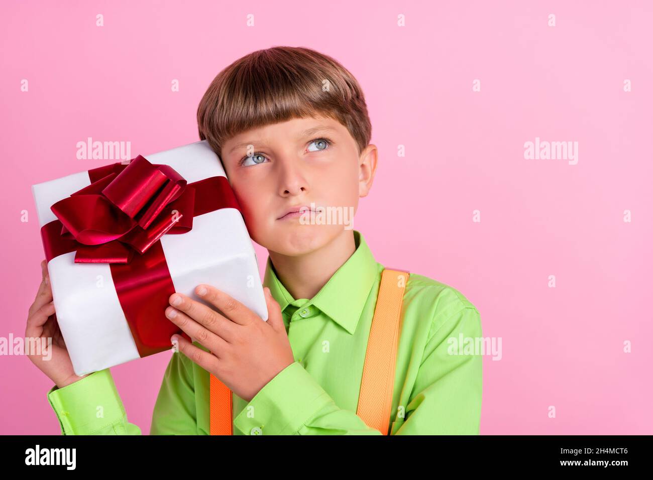 Photo of young little child boy birthday party present box curious ...