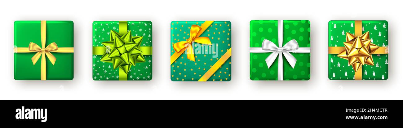 Gift box with green, white and golden ribbon and bow, top view ...