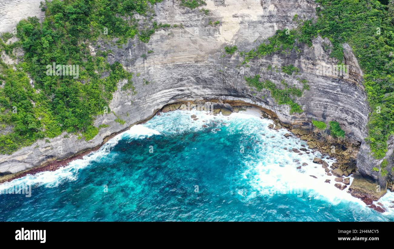 Taken by drone the view of the green cliffs with the beauty blue ocean ...