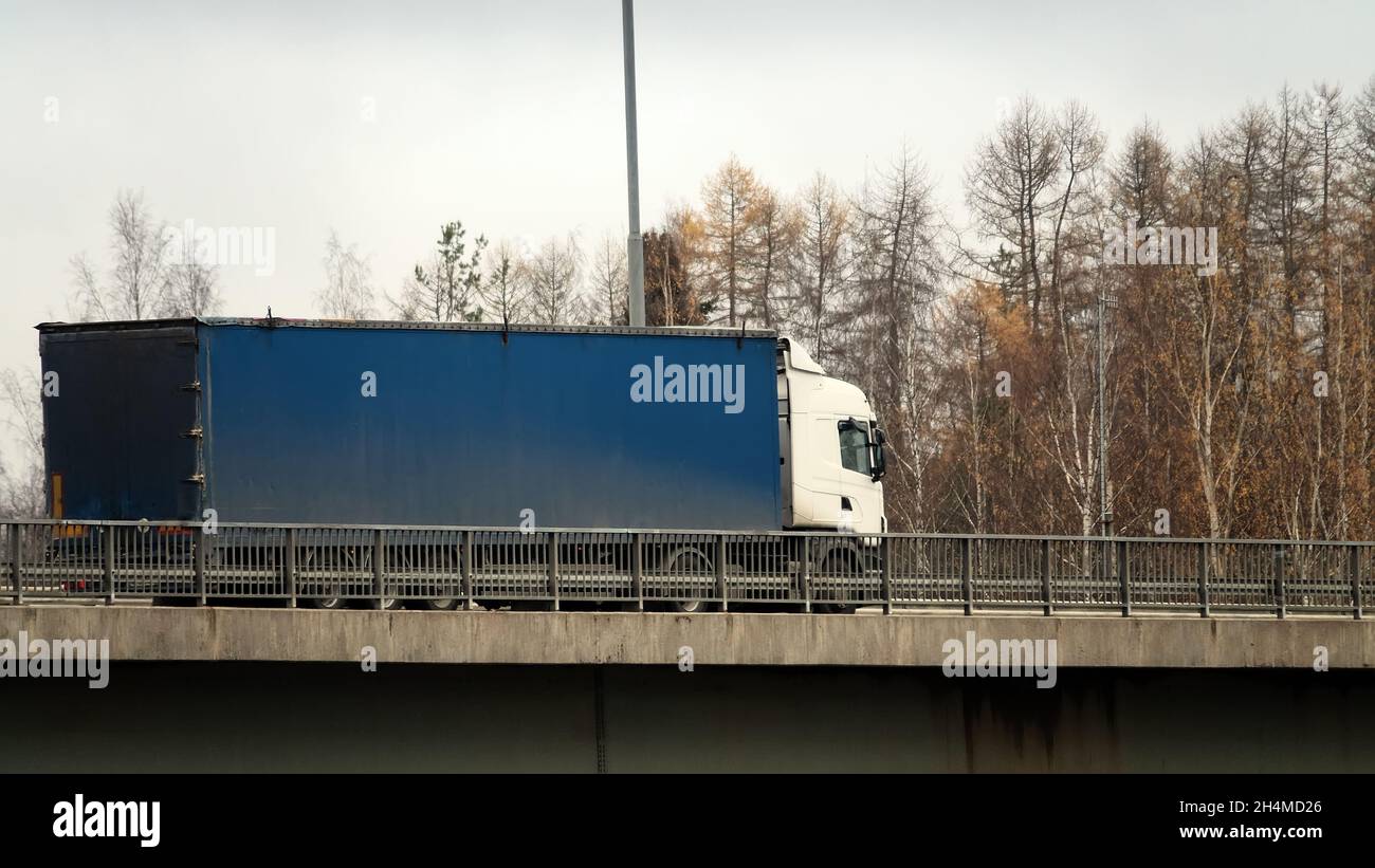 Unrecognizable truck transport on road. Transport overpasses on the ...