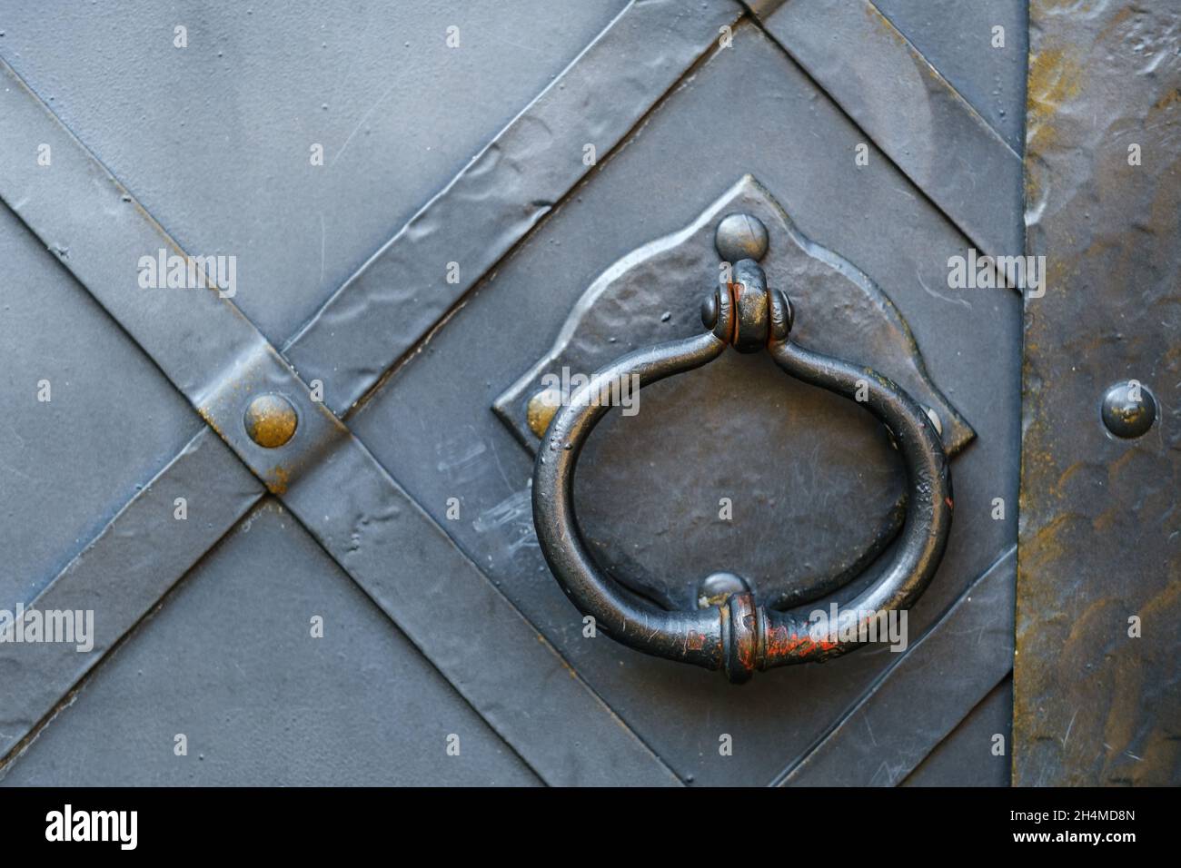 Old metal door handle on the old door Stock Photo - Alamy