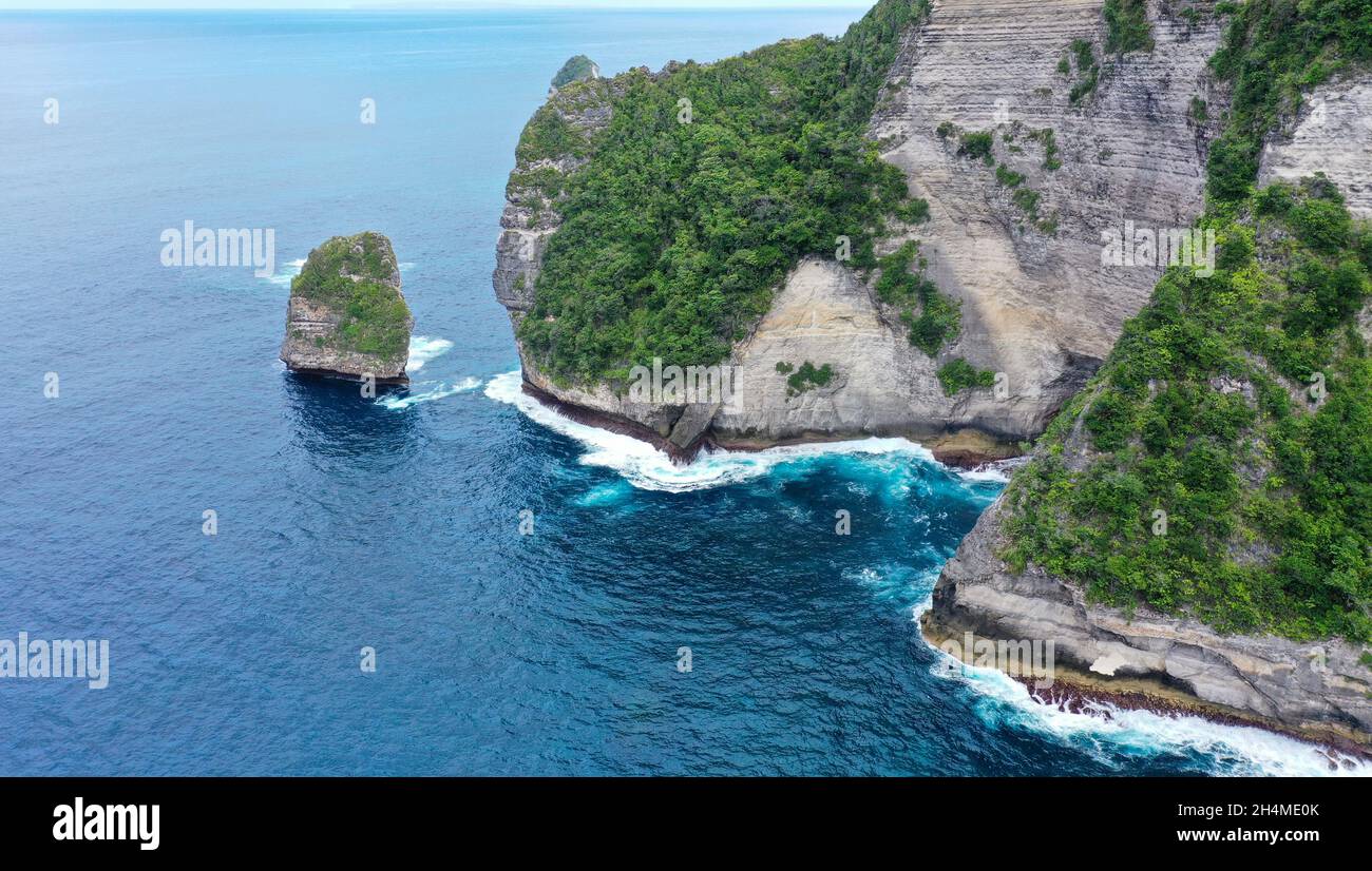 Taken by drone the view of the green cliffs with the beauty blue ocean ...