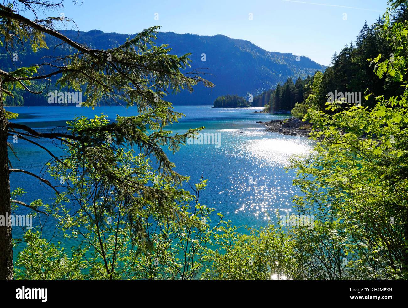 picturesque turquoise lake Eibsee by the foot of mountain Zugspitze in ...