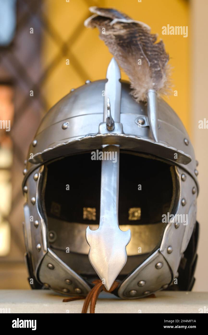 An ancient knight's helmet with a feather .Medieval concept Stock Photo ...