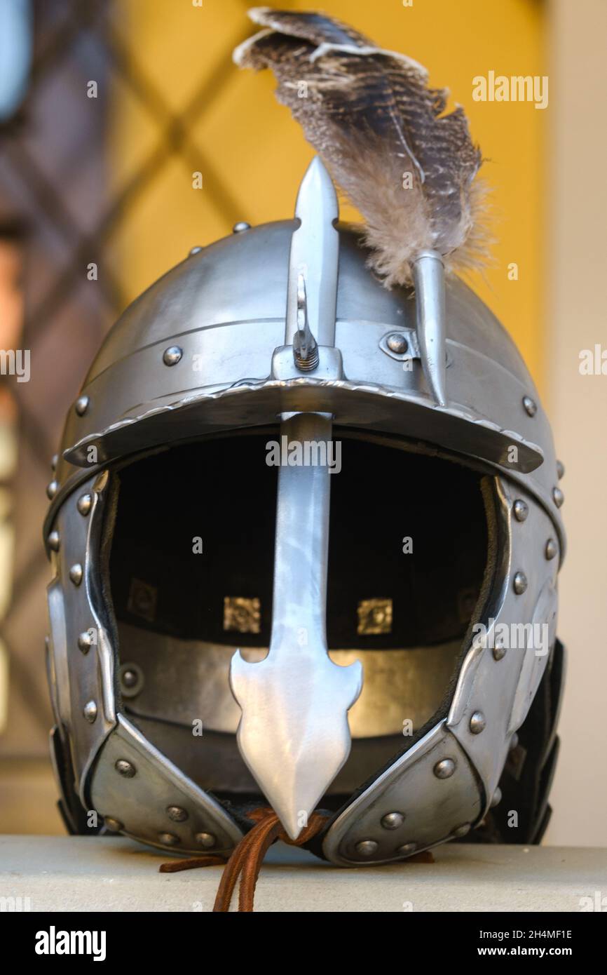 An ancient knight's helmet with a feather .Medieval concept Stock Photo ...