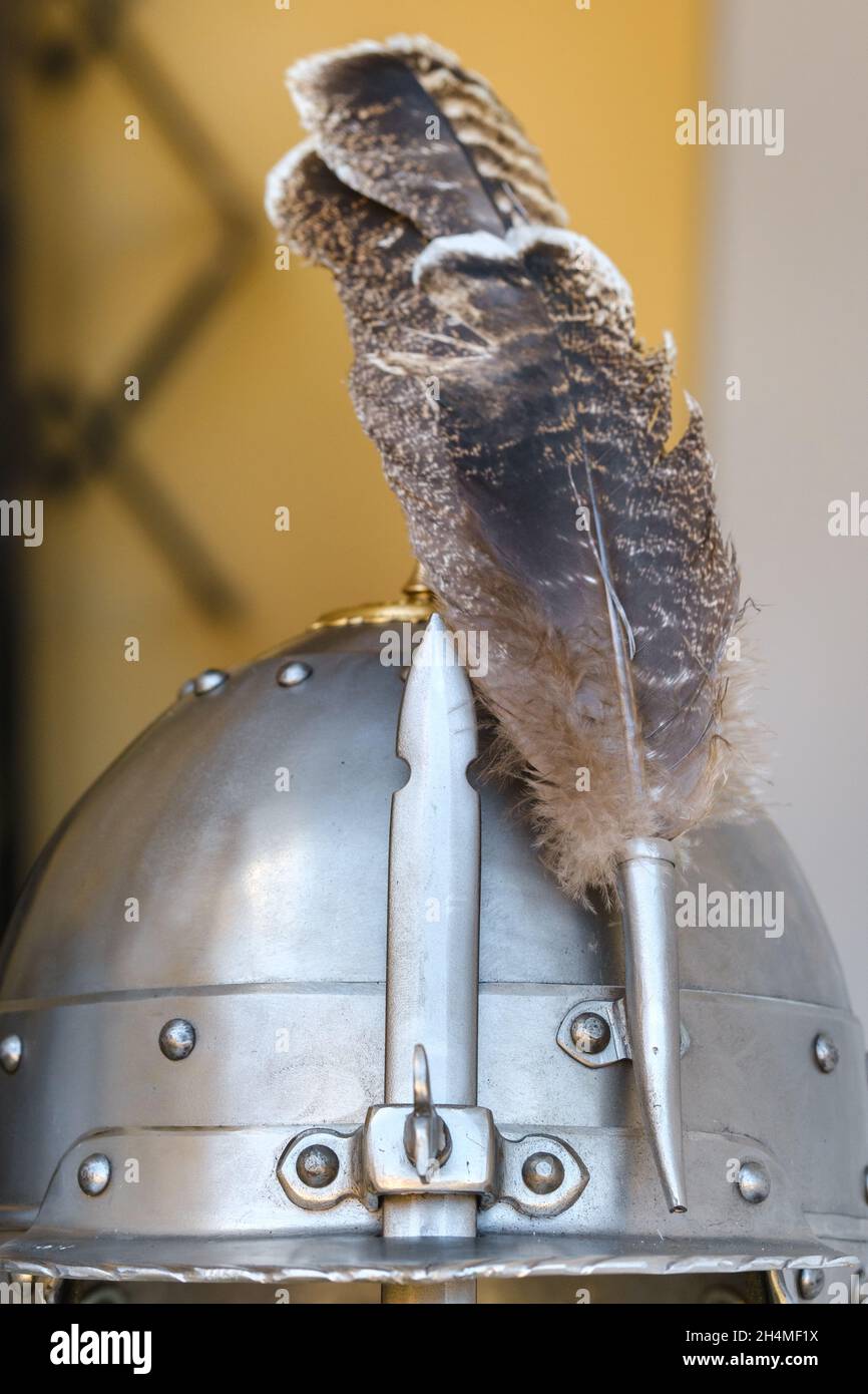 An ancient knight's helmet with a feather .Medieval concept Stock Photo ...