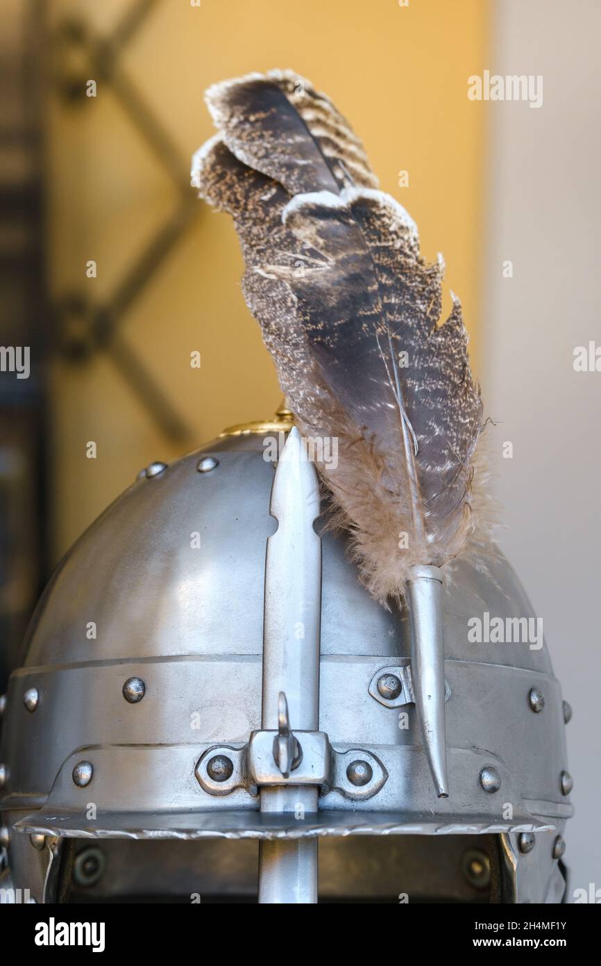 An ancient knight's helmet with a feather .Medieval concept Stock Photo ...