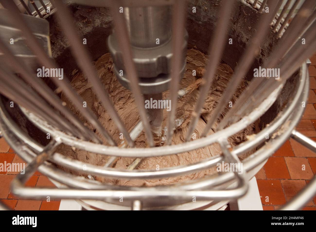 The process of making cookie dough in an industrial kneading machine at ...