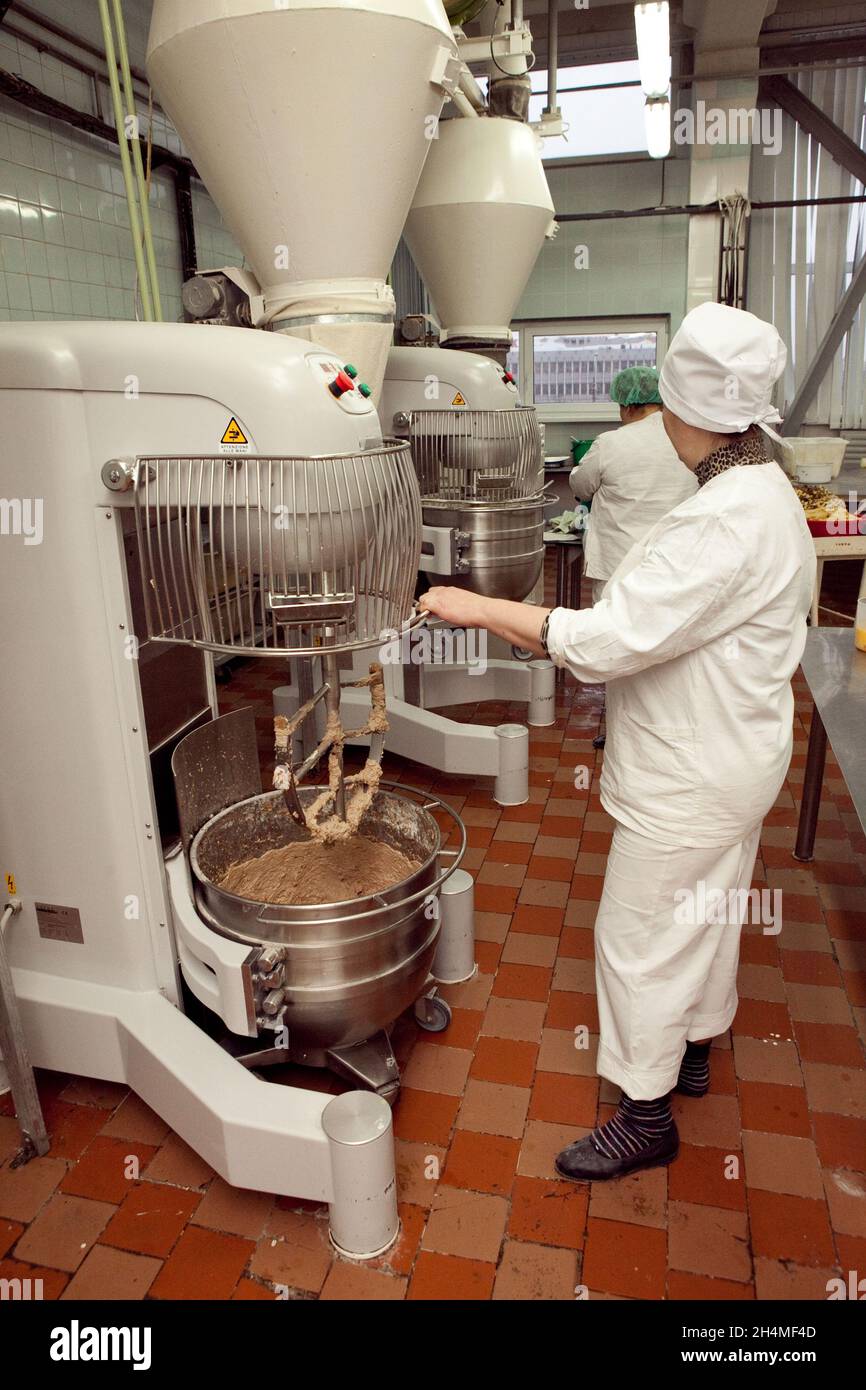 The process of making cookie dough in an industrial kneading machine at ...