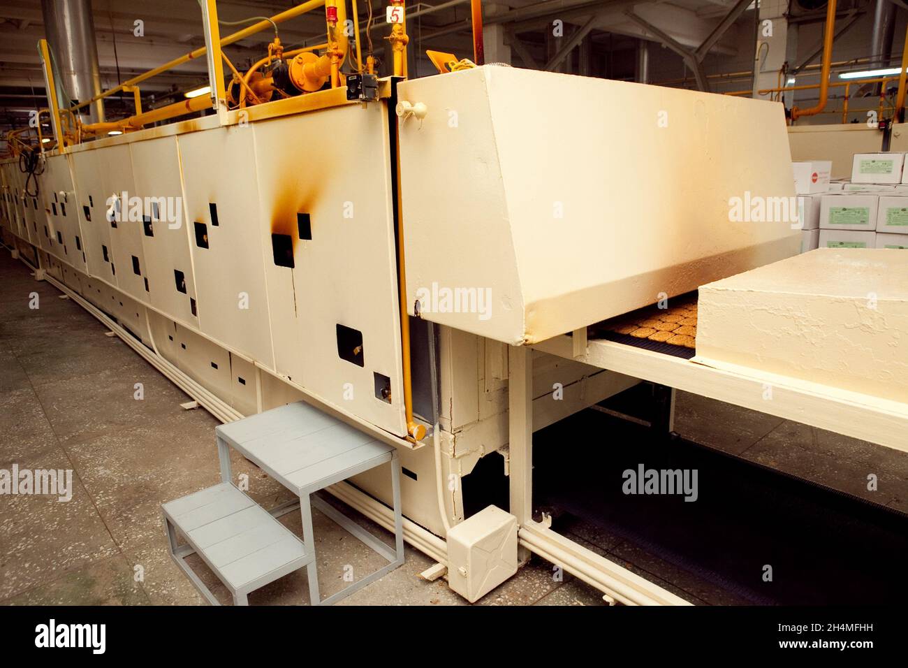 cookie making machine in the factory Stock Photo - Alamy