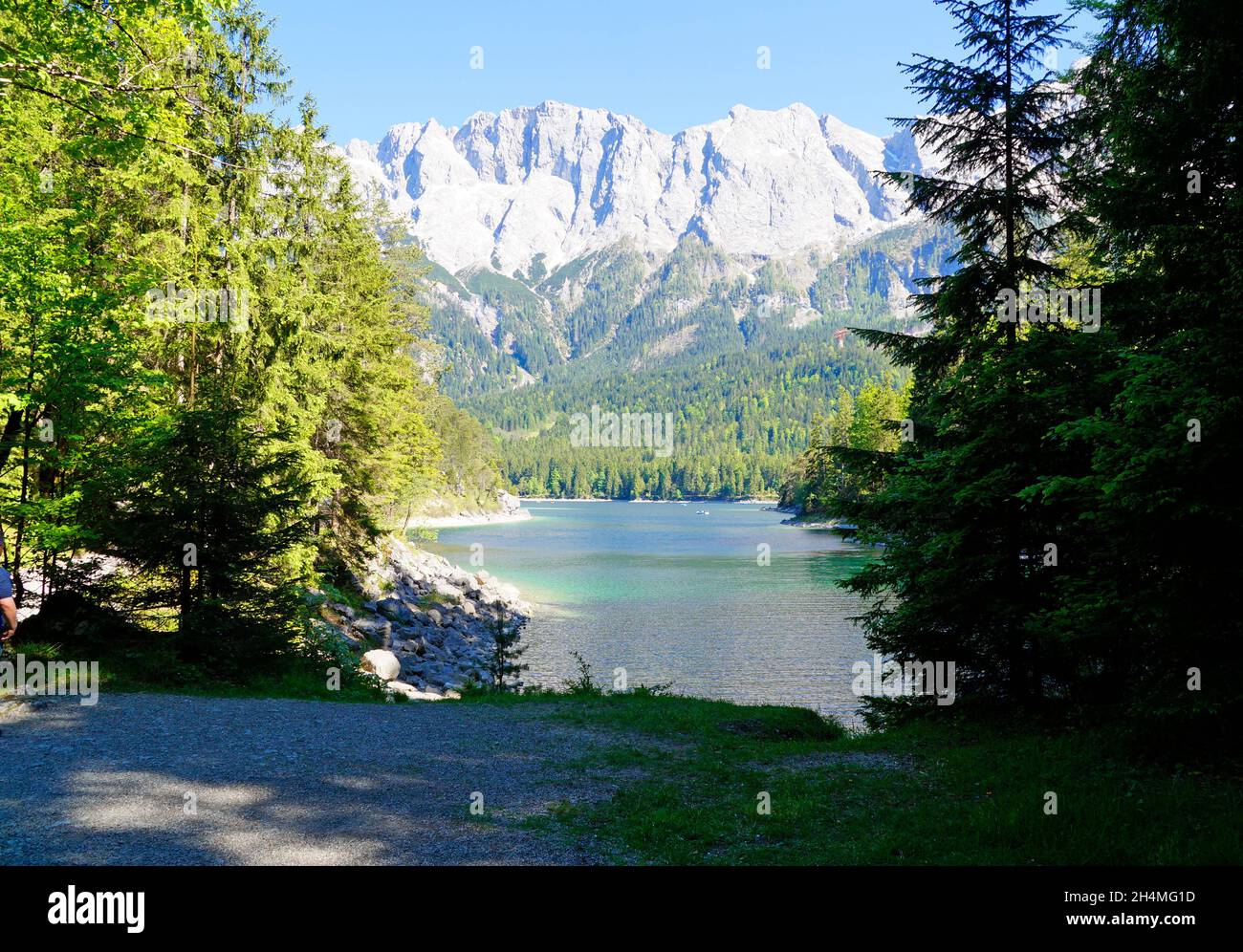 picturesque little island on turquoise lake Eibsee by the foot of ...
