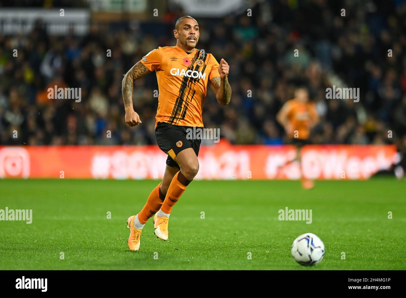 Josh Magennis #27 of Hull City tries to get onto the long ball Stock ...