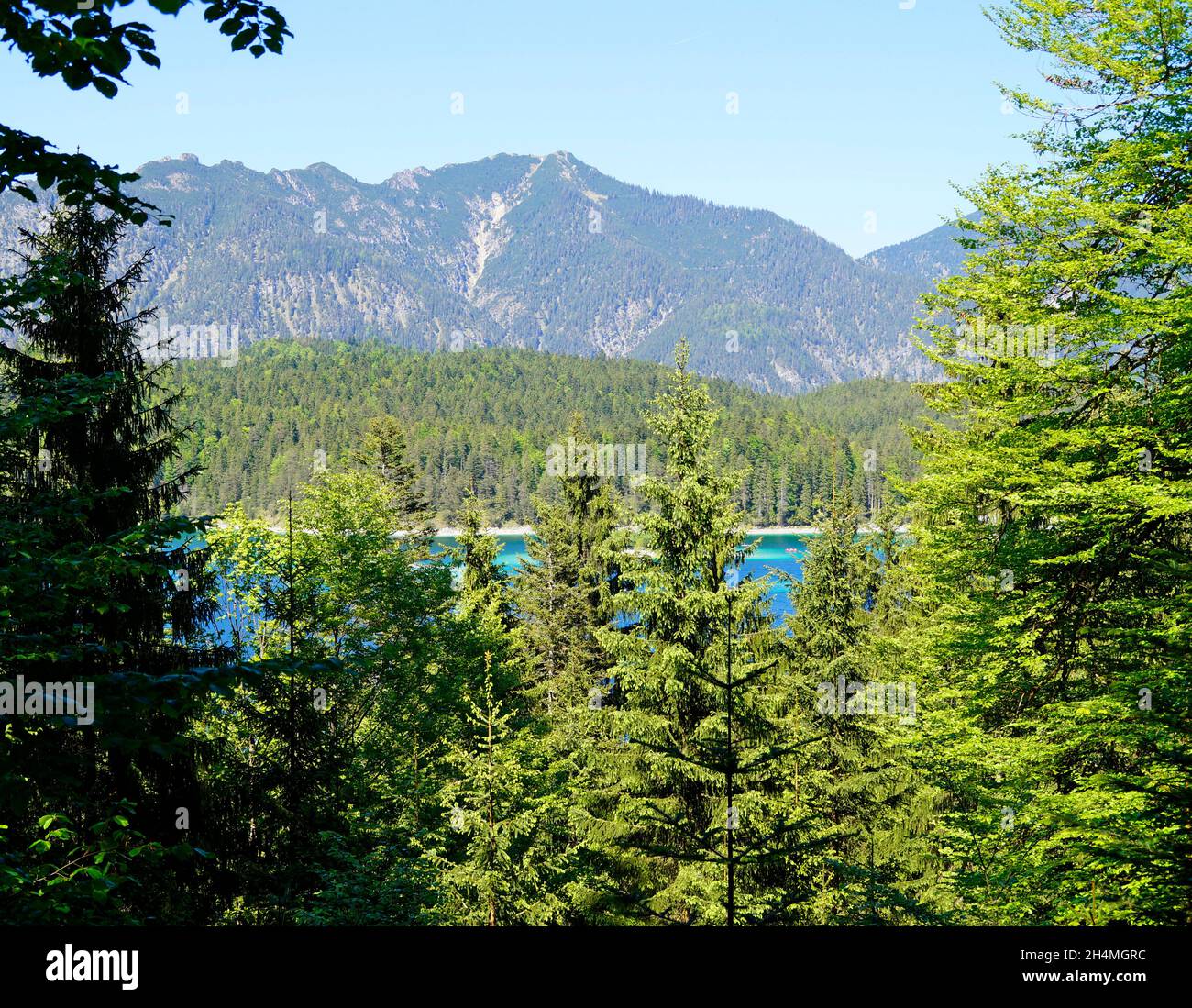 picturesque turquoise lake Eibsee by the foot of mountain Zugspitze in ...