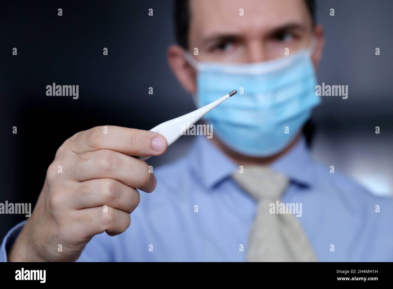 Fever man thermometer hi-res stock photography and images - Alamy