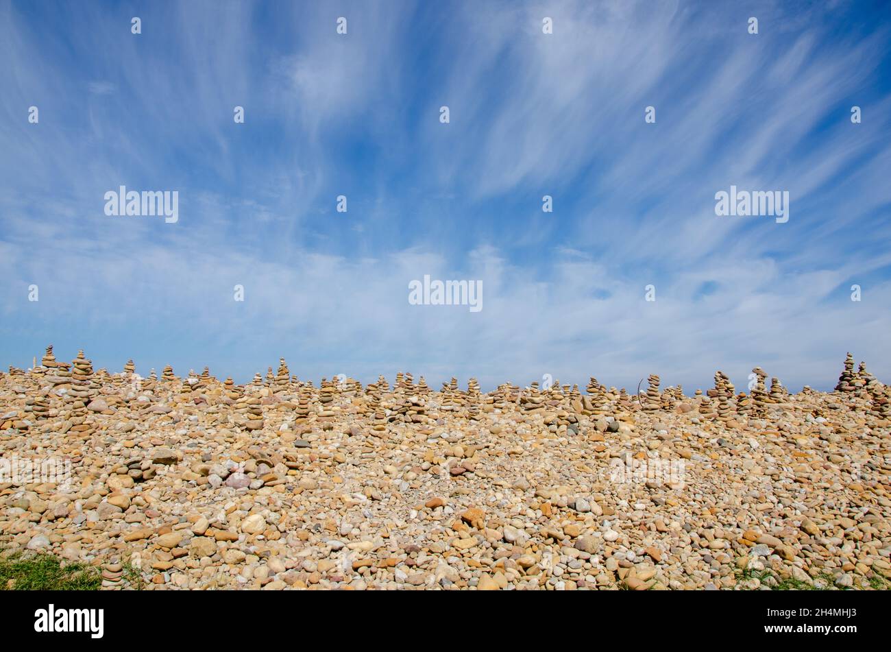Cairns built by visitors to Lindisfarne Castle on Holy Island, off the ...