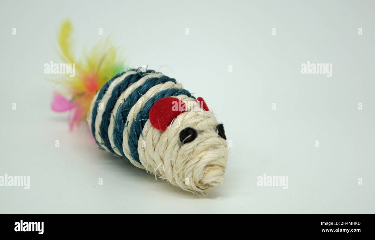 Play mouse made of rope and feathers for cats. White background and ...