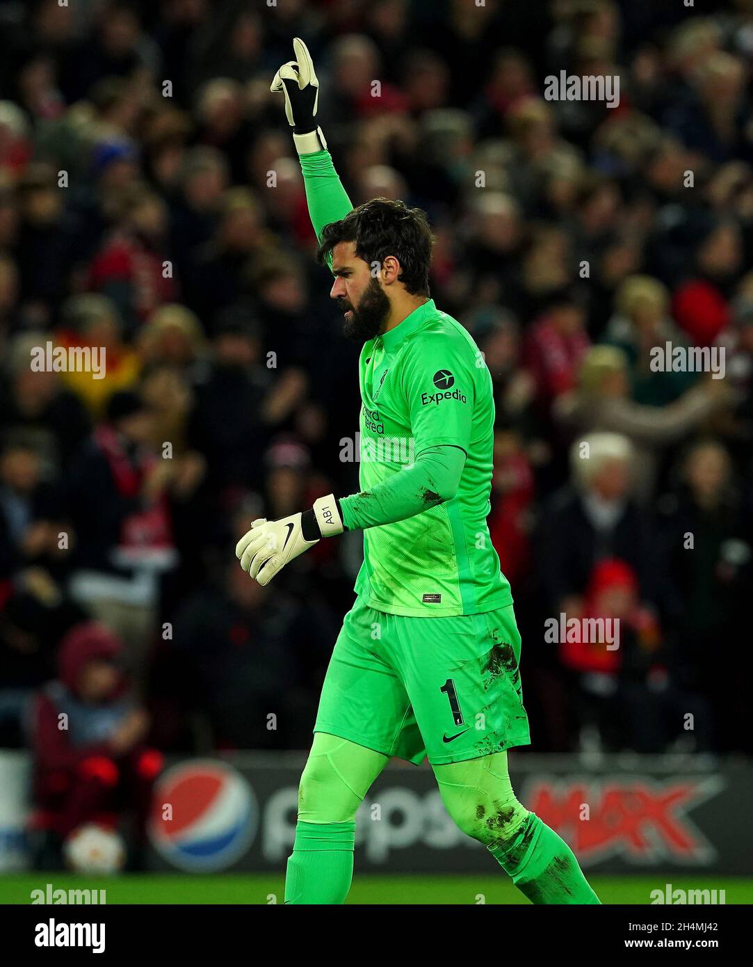 Liverpool goalkeeper Alisson celebrates his side's first goal of the ...