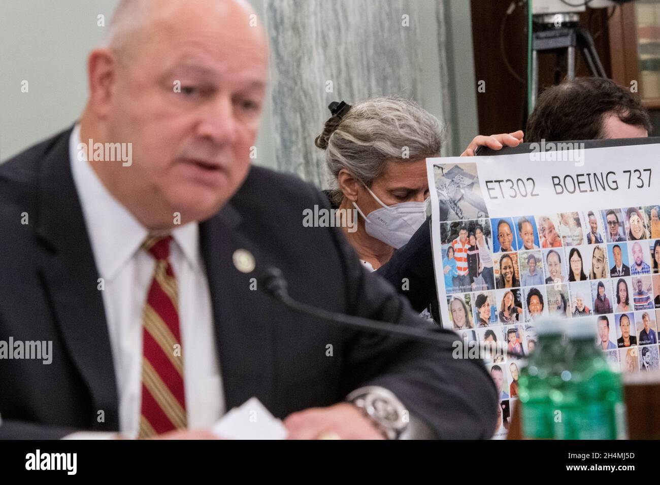 Nadia Milleron, right, the mother of Samya Rose Stumo holds a sign with ...