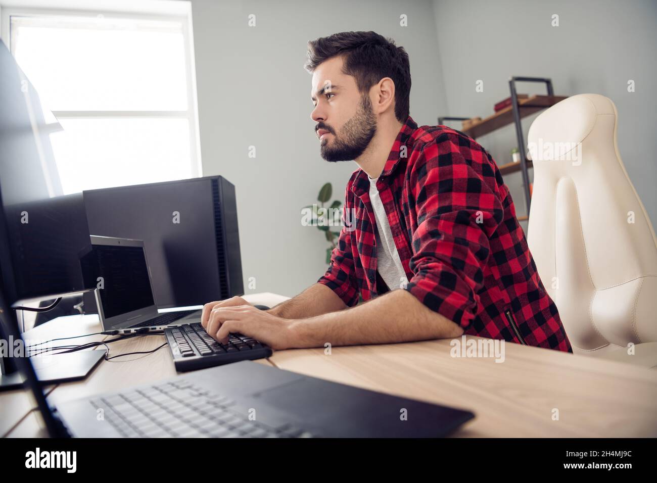 Profile side photo of serious young man write code software designer ...