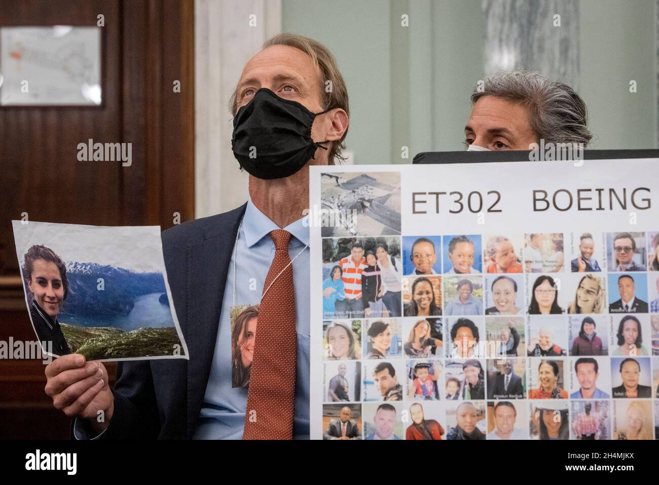 Michael Stumo, left, holds a photo of his daughter Samya Rose Stumo ...