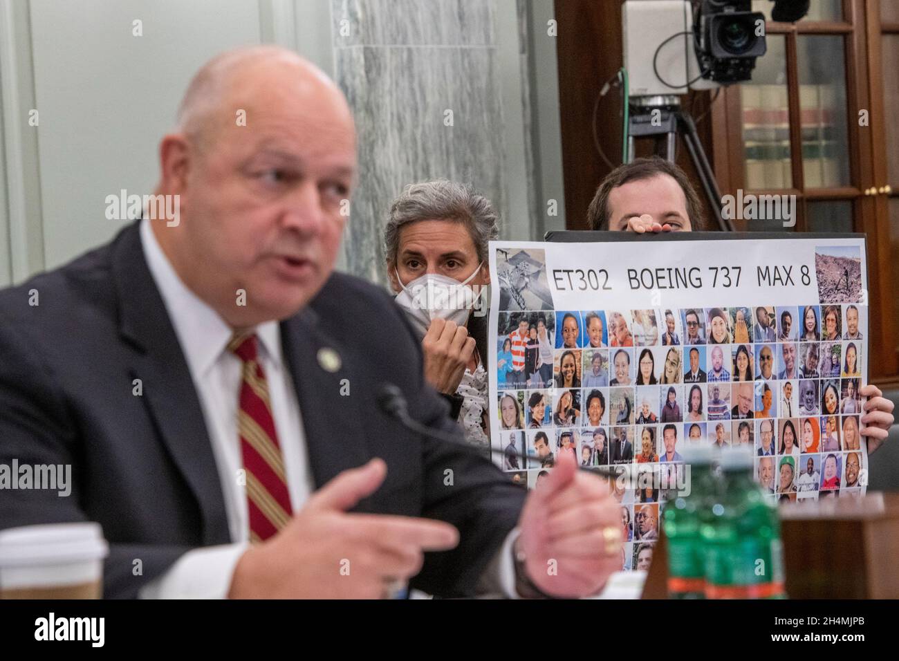 Nadia Milleron, right, the mother of Samya Rose Stumo holds a sign with ...