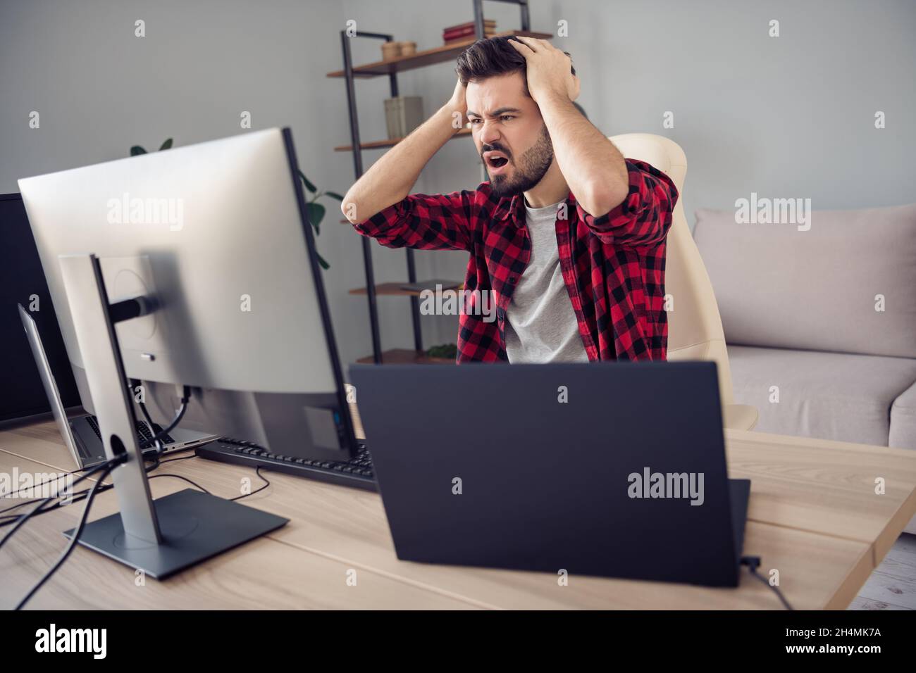 Photo of unhappy upset young man look screen pc mistake code software ...