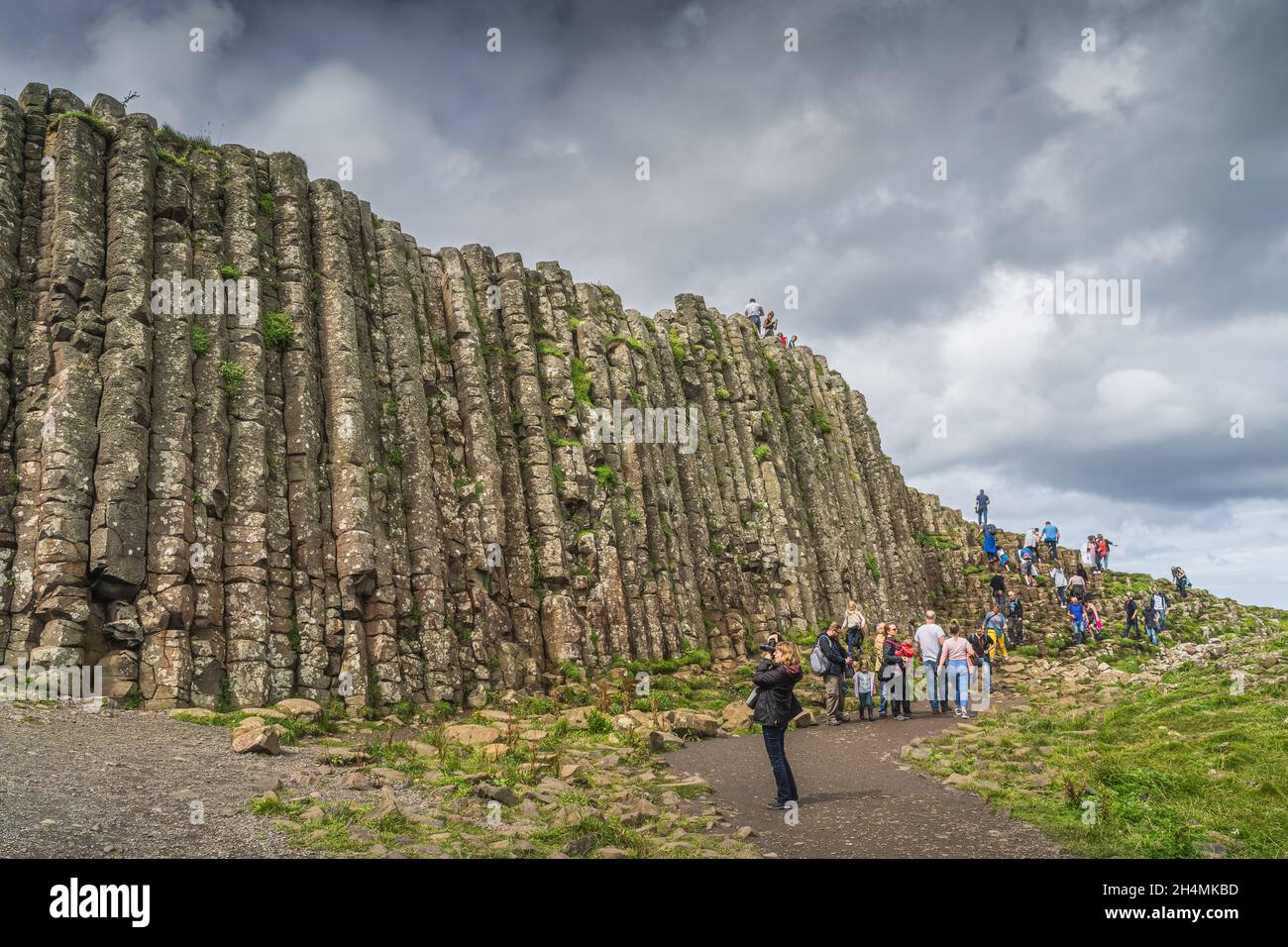 Bushmills, Northern Ireland, Aug 2019 Tourists photographing hexagonal ...