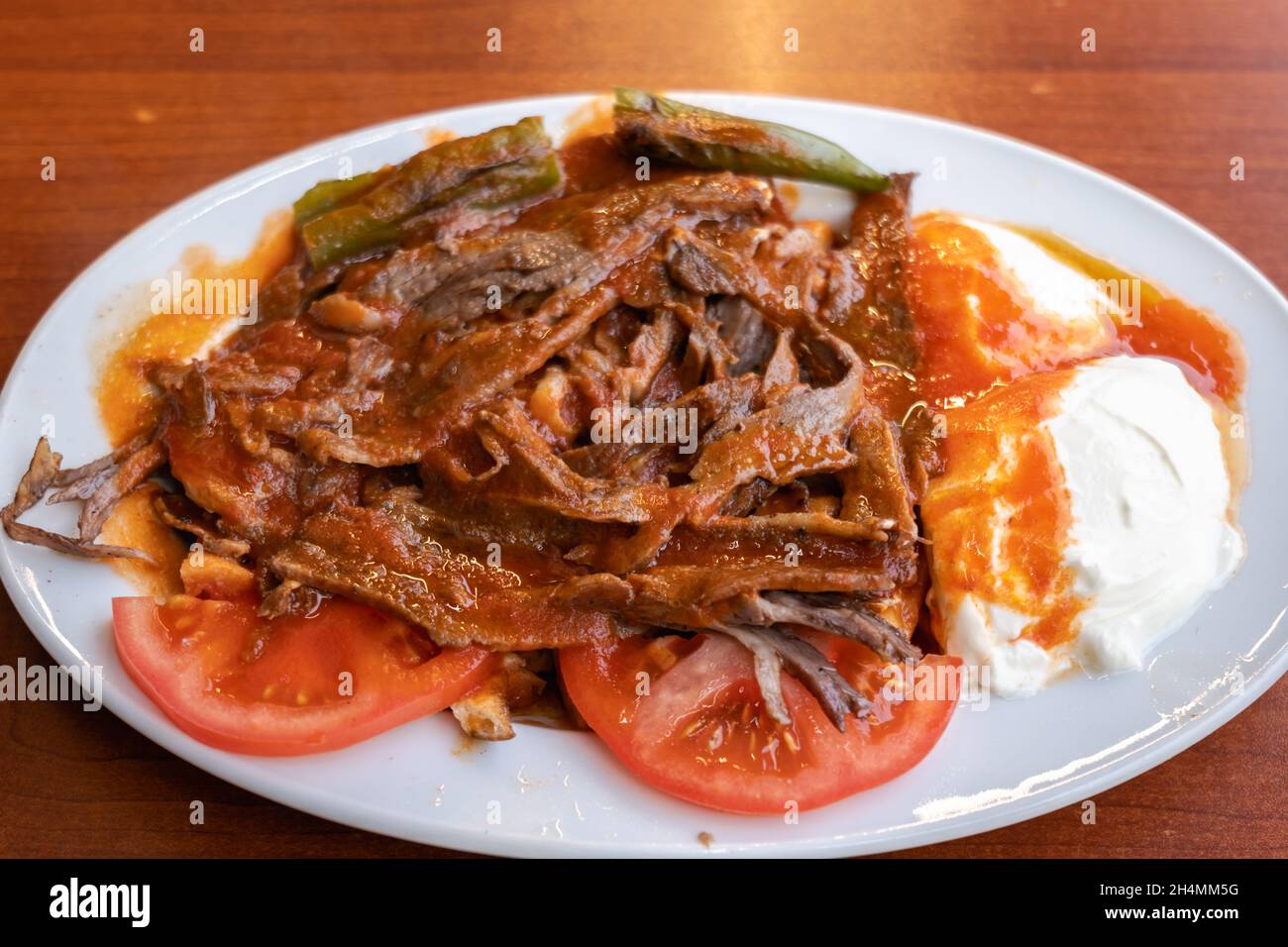 Iskender kebab, or Iskender Doner, a famous Turkish kebab dish ...