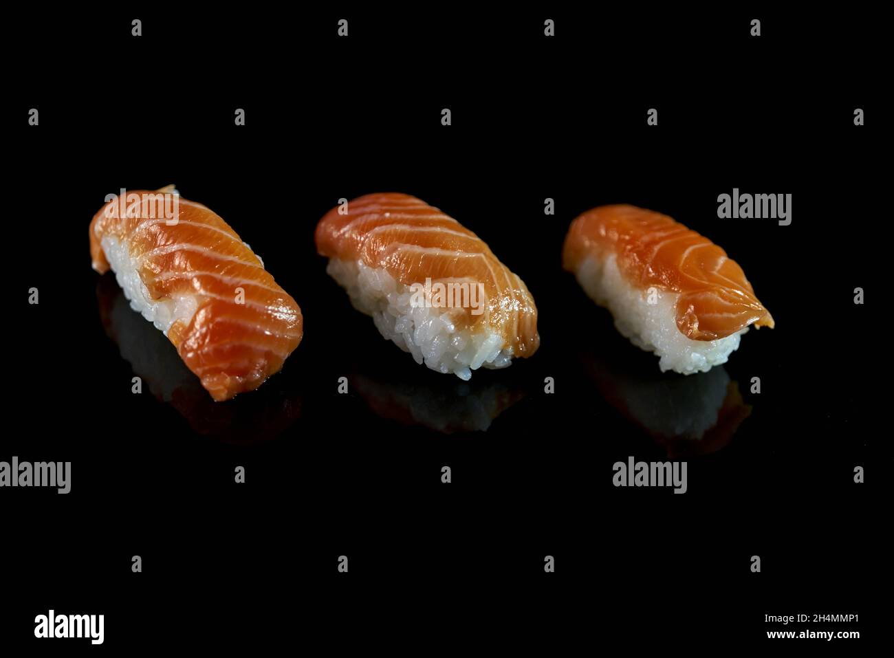 Closeup shot of raw fish sashimi isolated on black background Stock ...