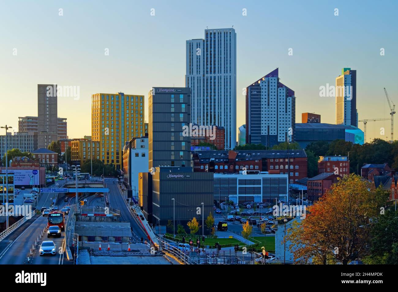 UK,West Yorkshire,Leeds, City Skyline at Dusk, from Footbridge over ...