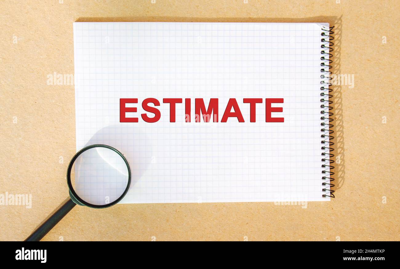 Notebook with the inscription Estimate and a magnifying glass. Process ...