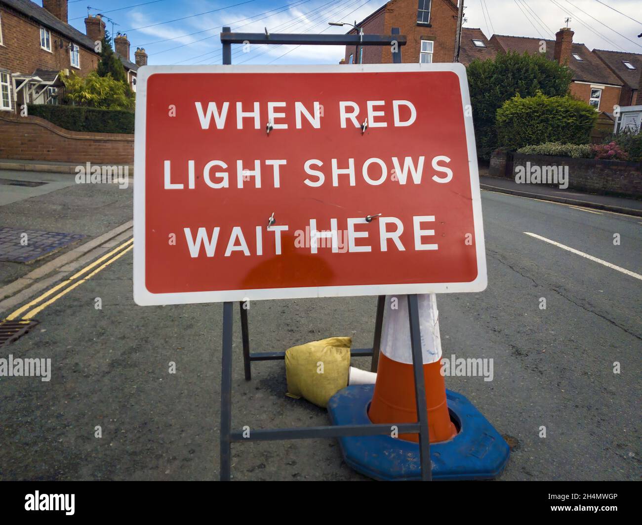 Red warning sign at road works Stock Photo - Alamy
