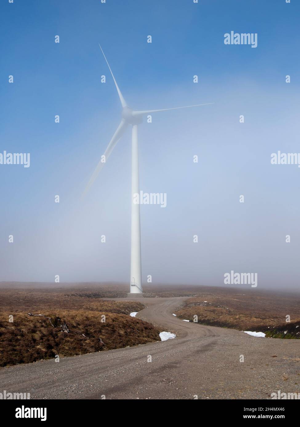 Wind turbine emerging from the mist. Corrimony Wind Farm, Highland ...