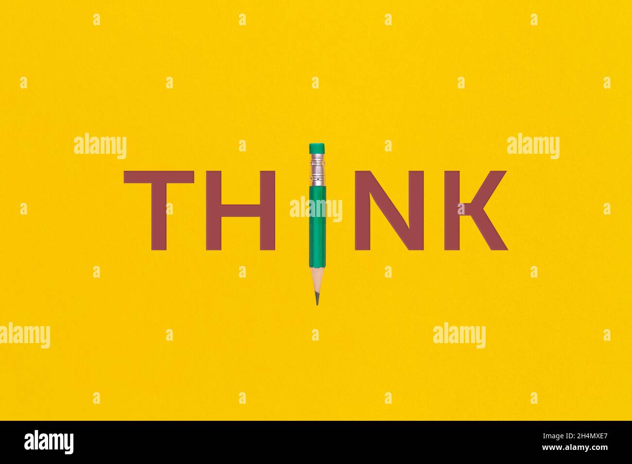 The word "Think" on yellow background. Top view or flat lay Stock Photo ...