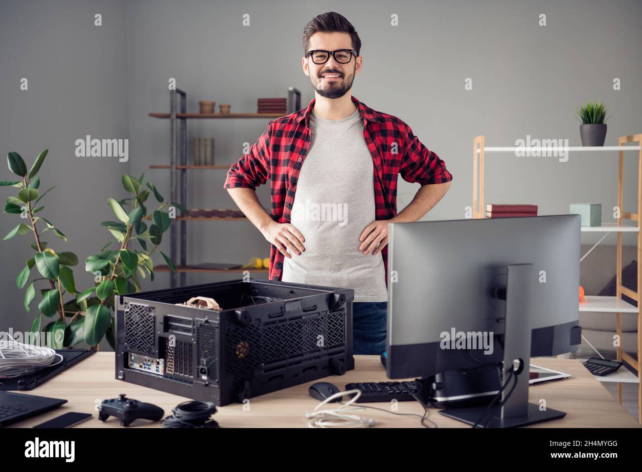 Portrait of attractive cheerful skilled trendy guy improving ...