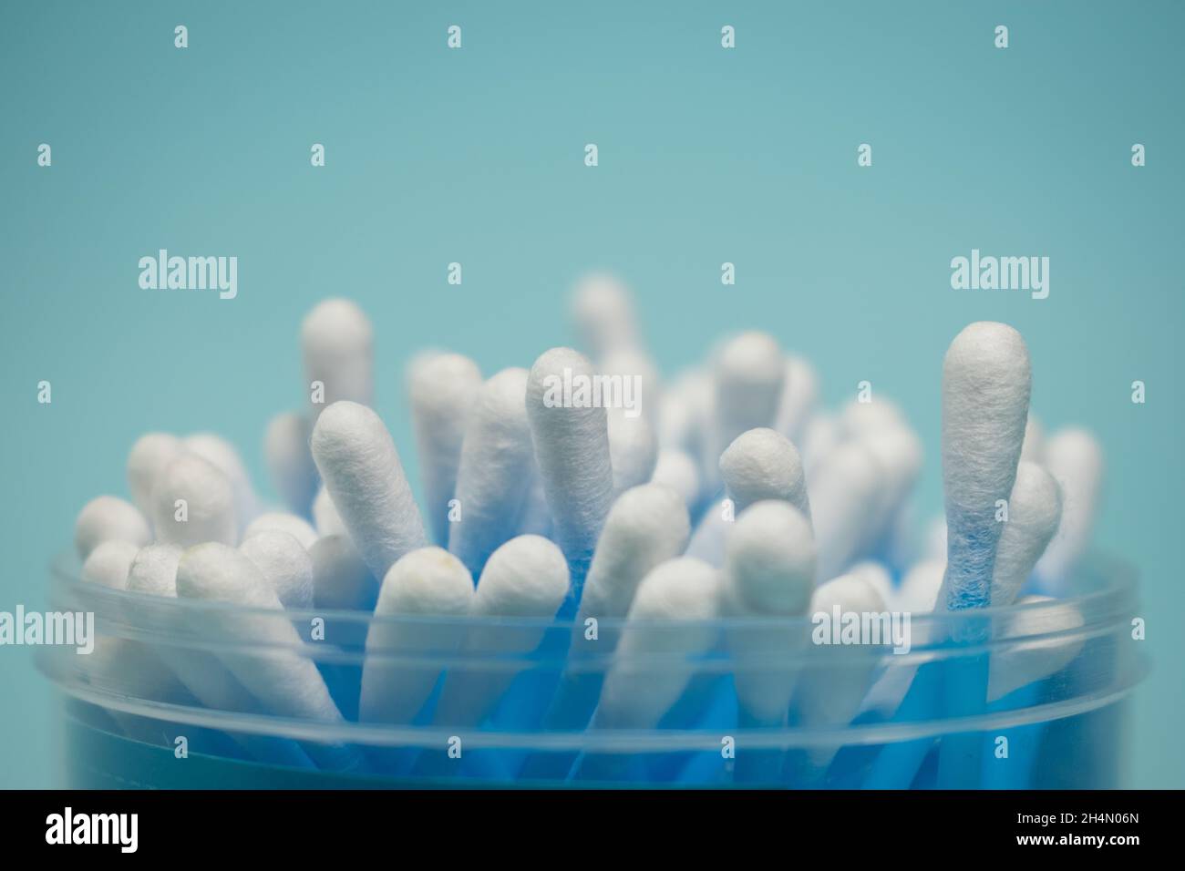 Blue cotton swabs with blue background Stock Photo - Alamy
