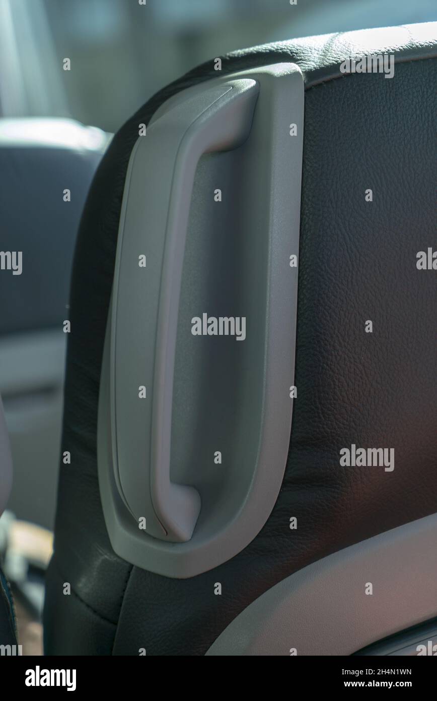 Seat handle in the bus under the sunlight Stock Photo - Alamy