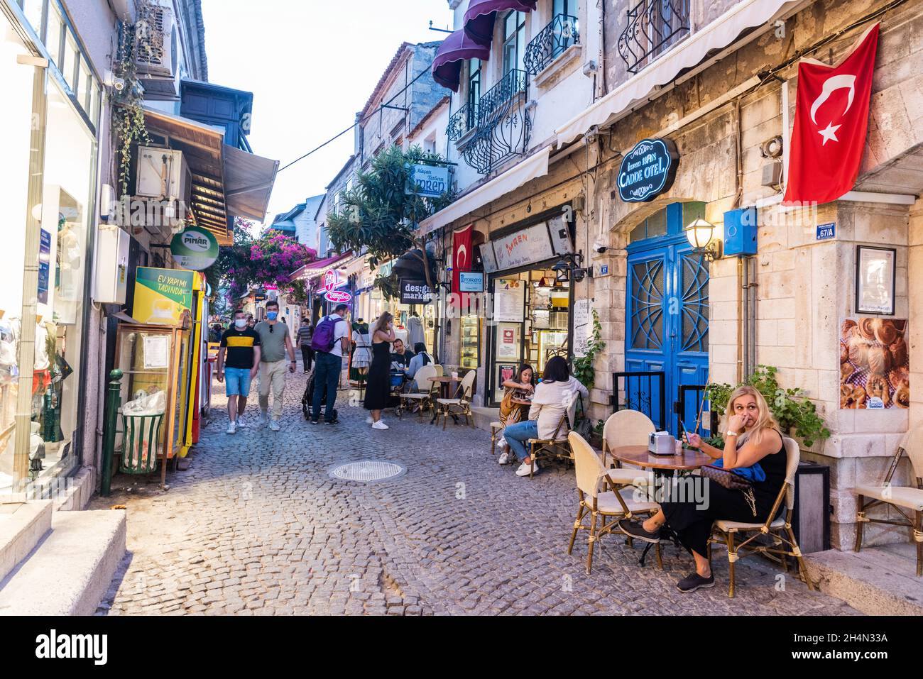 Alacati, Izmir, Turkey – October 3, 2020. A narrow cobbled street in ...