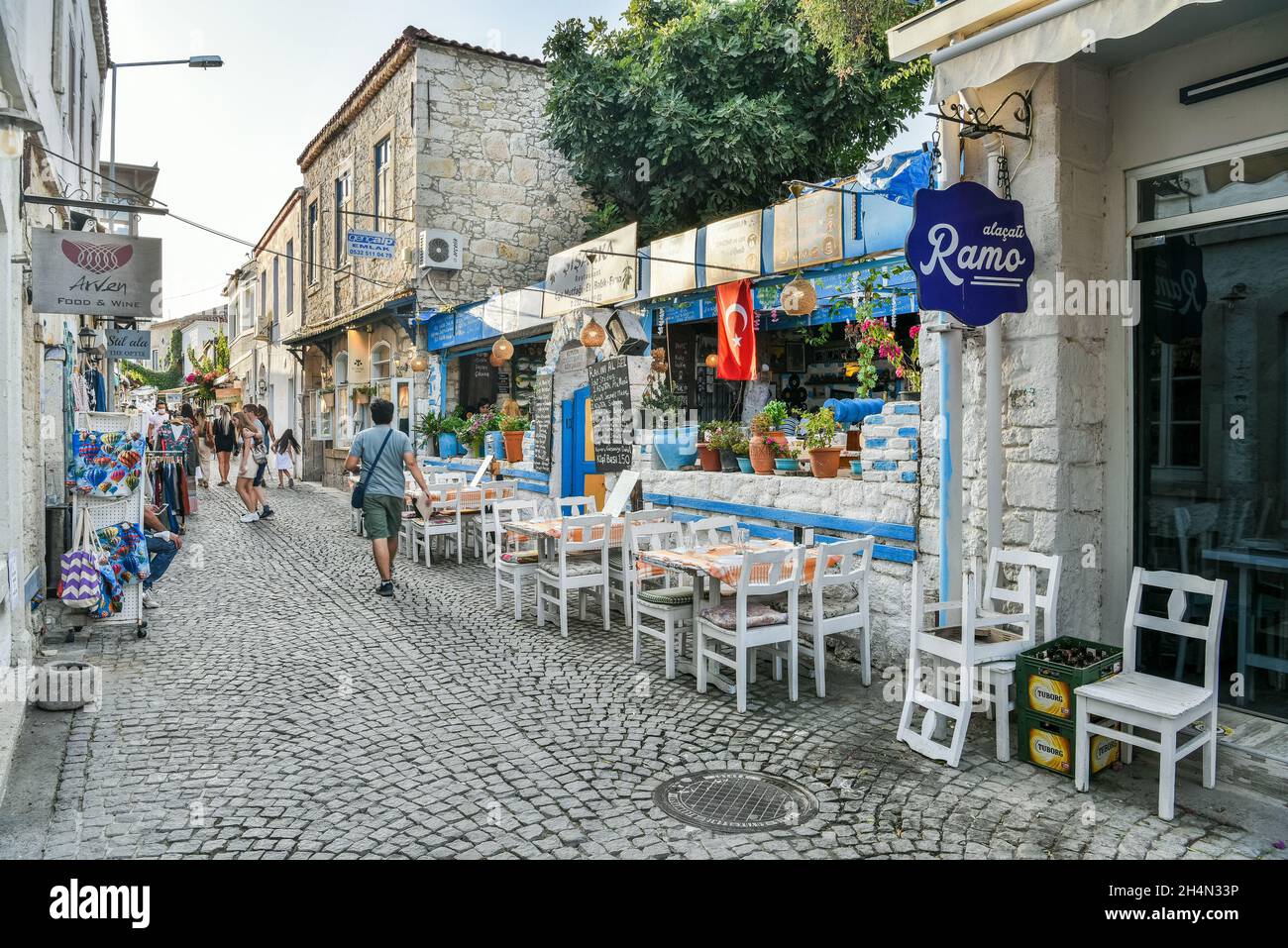 Alacati, Izmir, Turkey – October 3, 2020. A narrow cobbled street in ...