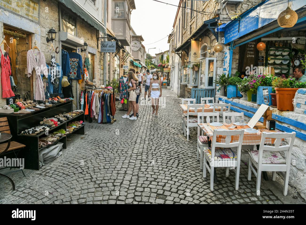 Alacati, Izmir, Turkey – October 3, 2020. A narrow cobbled street in ...